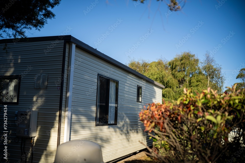Caravan camping at a camp ground off grid on a holiday in spring. Stock ...