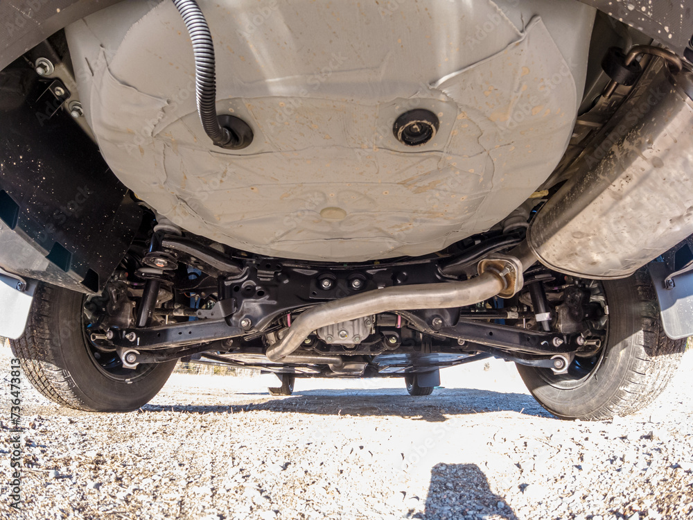 Foto de Auto mechanic view of bottom of the car. Rear differential axle ...