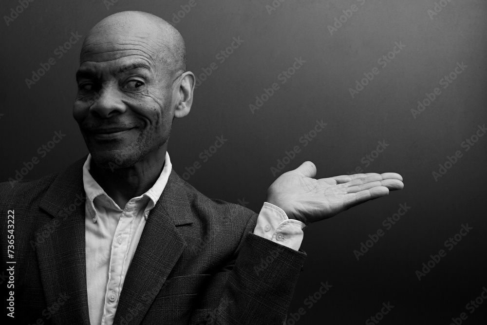 man pointing and showing the way with grey black background with people ...
