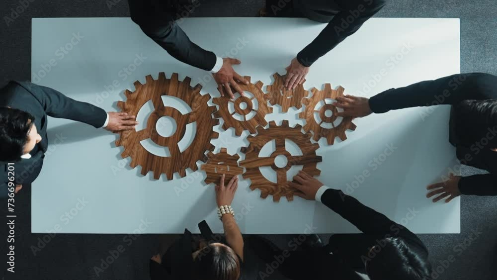 Vidéo Stock Top view of business people gather wooden cog together at ...