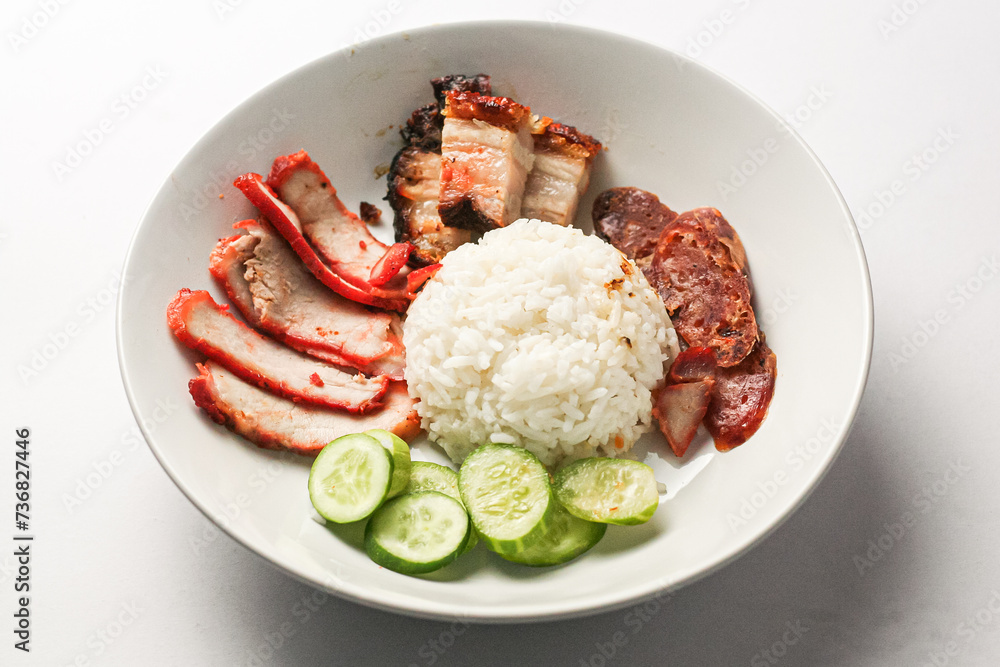 Red Pork and Crispy Pork on Rice Served with Chinese sausage, cucumber ...