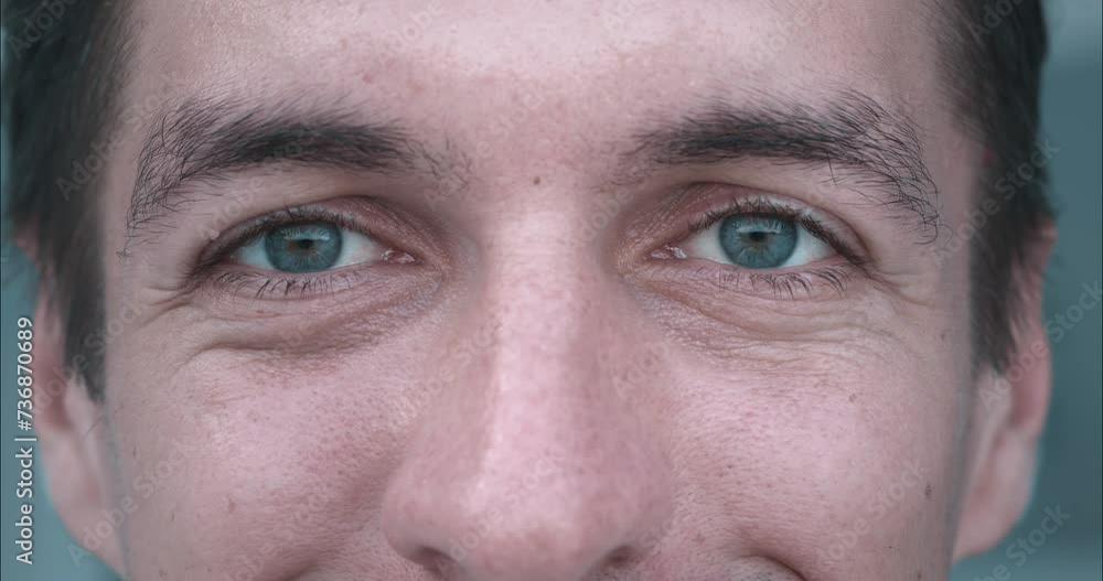 Close-up happy and satisfied eyes of man who smiles at camera. Sincere ...