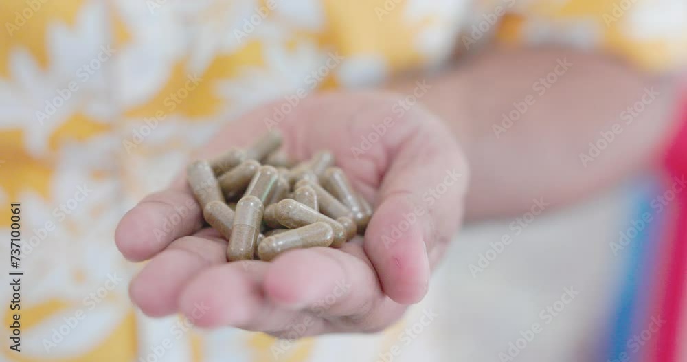 Man holding Vitamin supplement pills on male hand pouring capsules from ...
