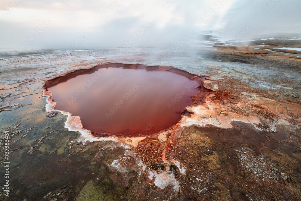 Red geothermal hot spring in Hveravellir nature reserve in Iceland ...