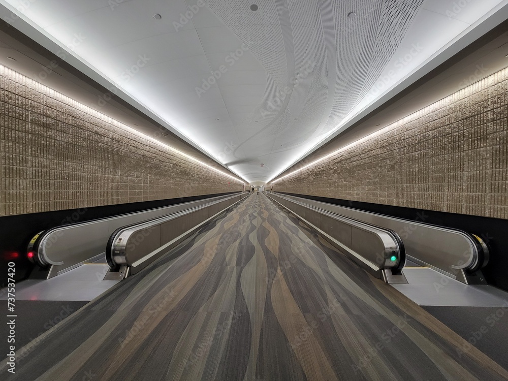 Long empty underground corridor of moving walkways inside Hartsfield ...
