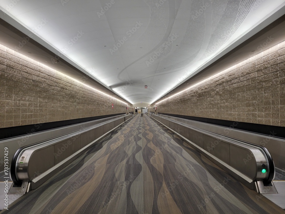 Long empty underground corridor of moving walkways inside Hartsfield ...