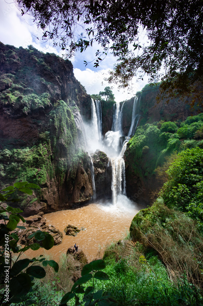 People watching the gigantic Ouzoud Waterfalls that empty into the El ...