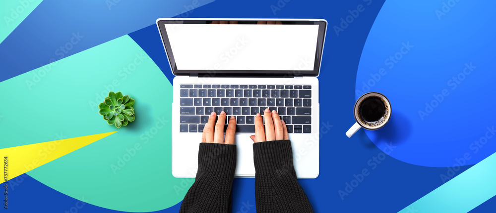 Person using a laptop computer from above Stock Photo | Adobe Stock