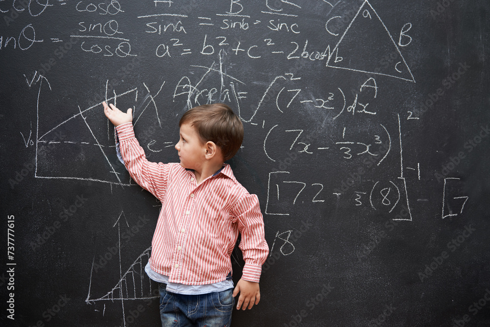 Child, boy and blackboard with math or equations for knowledge, numbers ...