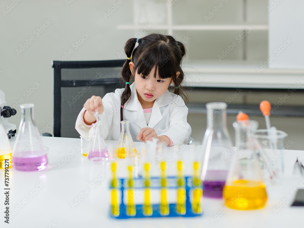 Asian little cute girl students in lab coat making test tube science ...
