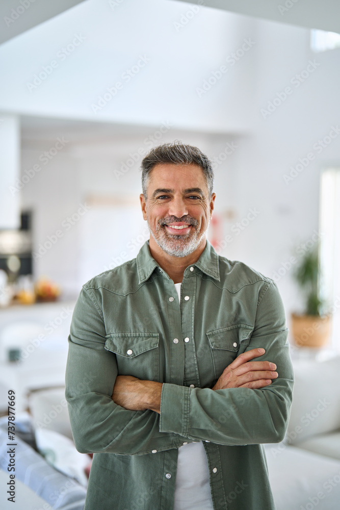 Happy confident middle aged senior man standing with arms crossed at ...