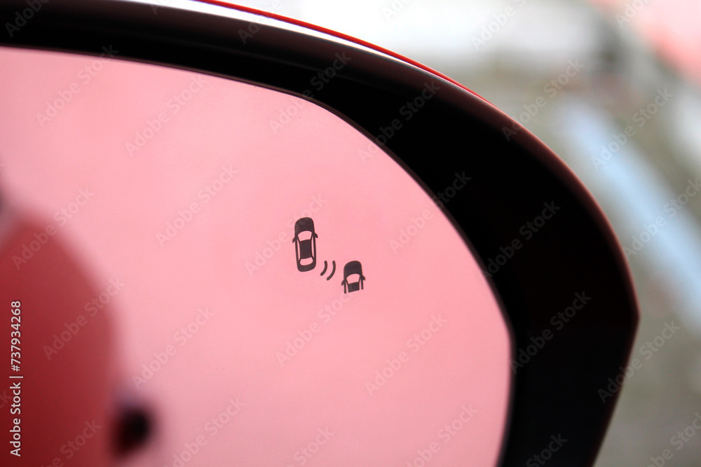 Blind zone monitoring sensor on the side mirror of a modern car. Modern ...