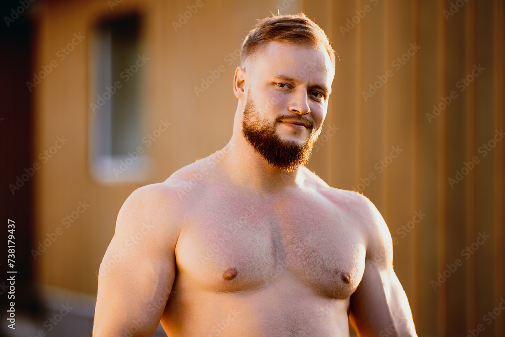 Muscular white man with goatee, about 30 years old, shirtless, outdoors ...