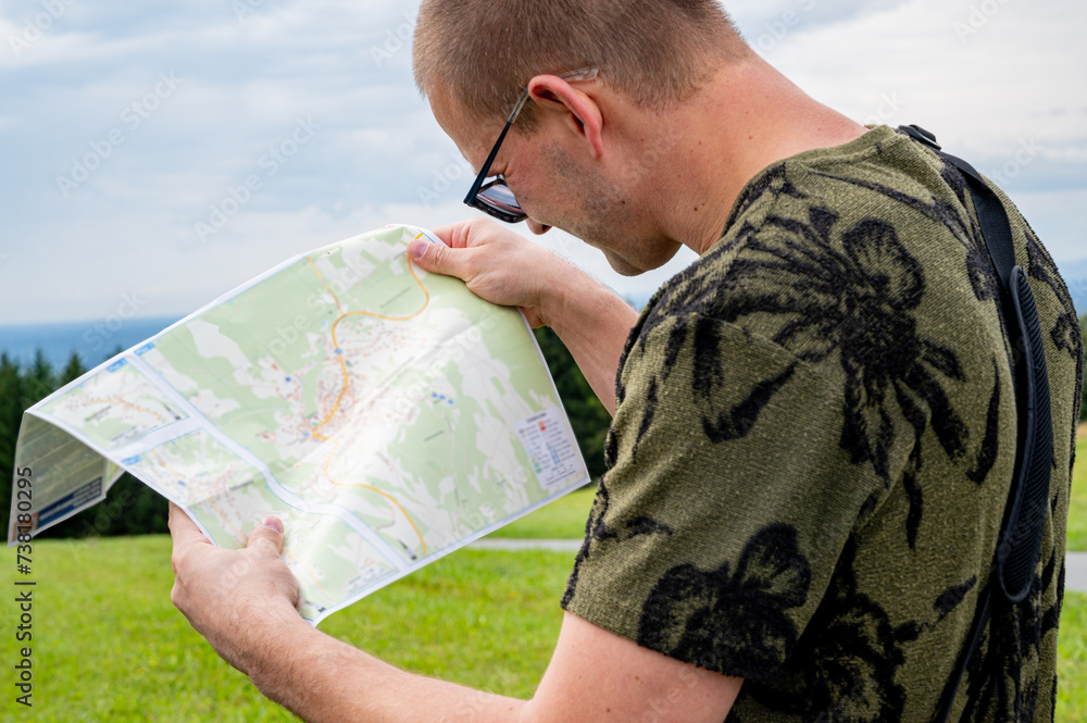 Man with touristic map in hands. Traveling Using Map. Man Holding Map ...