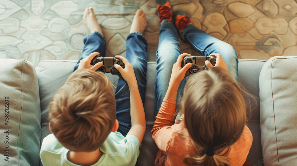 Boy and girl are immersed in playing a video game console at home ...