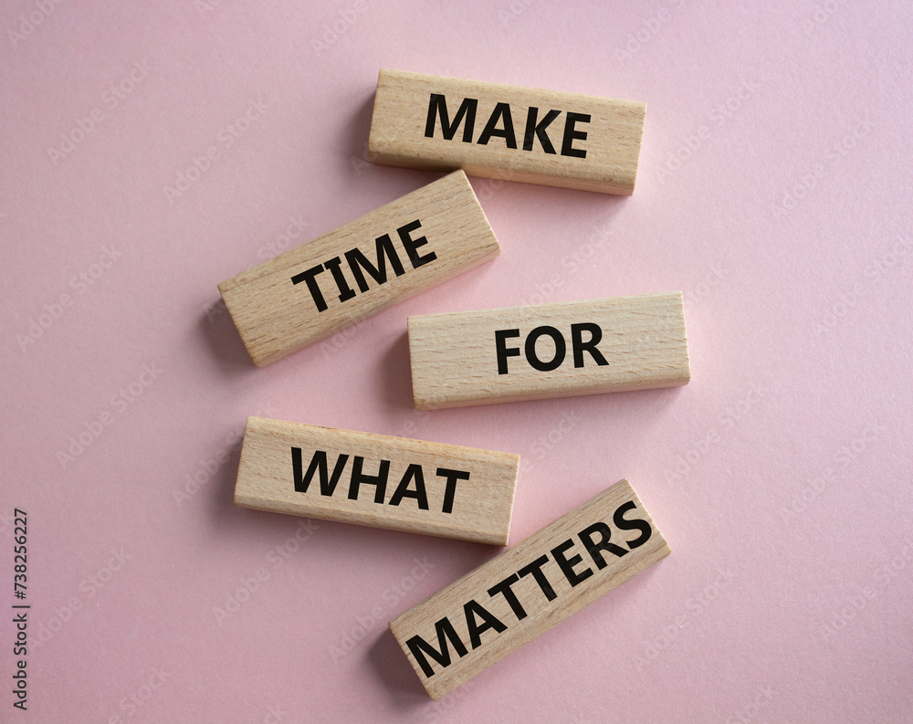 Important thing symbol. Wooden blocks with words Make time for what ...