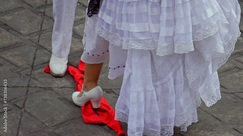 Close-up of the feet of a couple dancing a Mexican folkloric dance ...