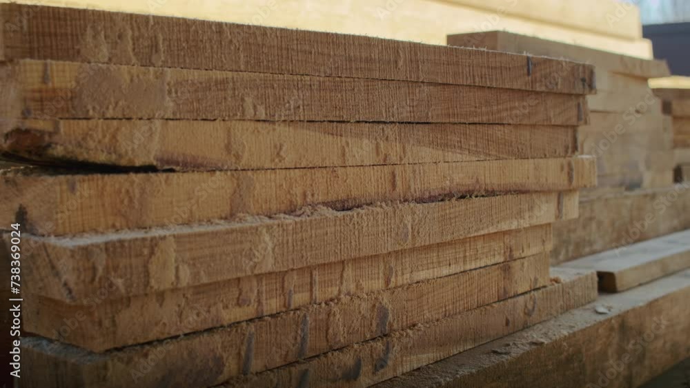 Stack of rough sawn lumber planks. Timber storage, woodwork and ...