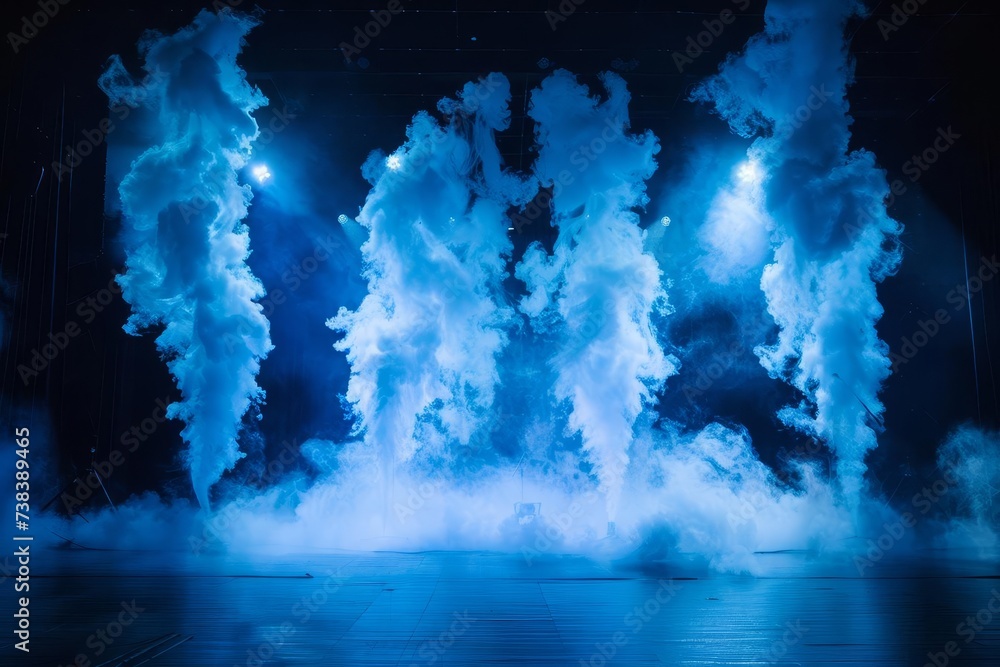 Stage illuminated by intense blue scenic lights with atmospheric smoke ...
