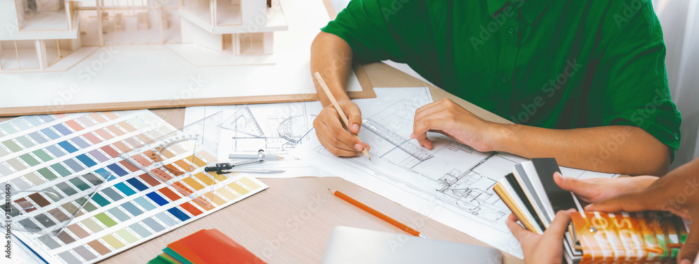 Professional architect drafts blueprint from project manager advice on ...