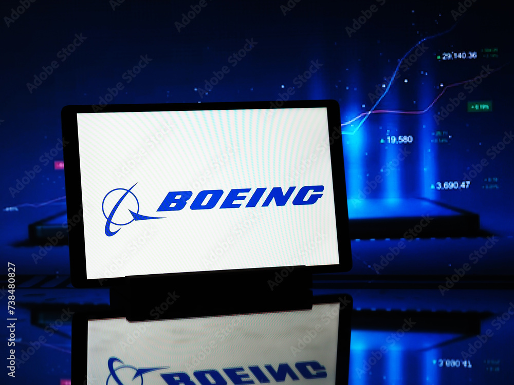 In this photo illustration, The Boeing Company logo seen displayed on a ...