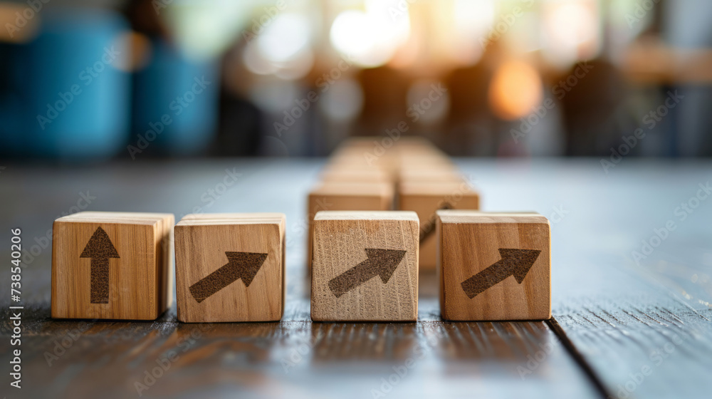 Arrowing symbols on wooden blocks on a table, featuring clean ...