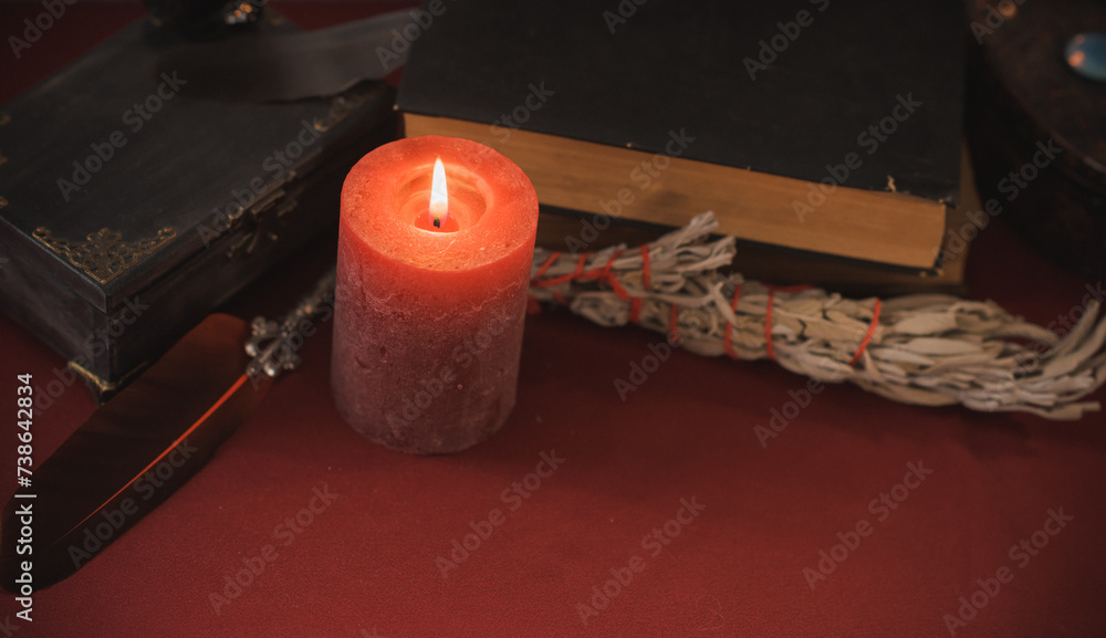Altar of modern witch. Candles and oracle stuff on a table. Mental work ...