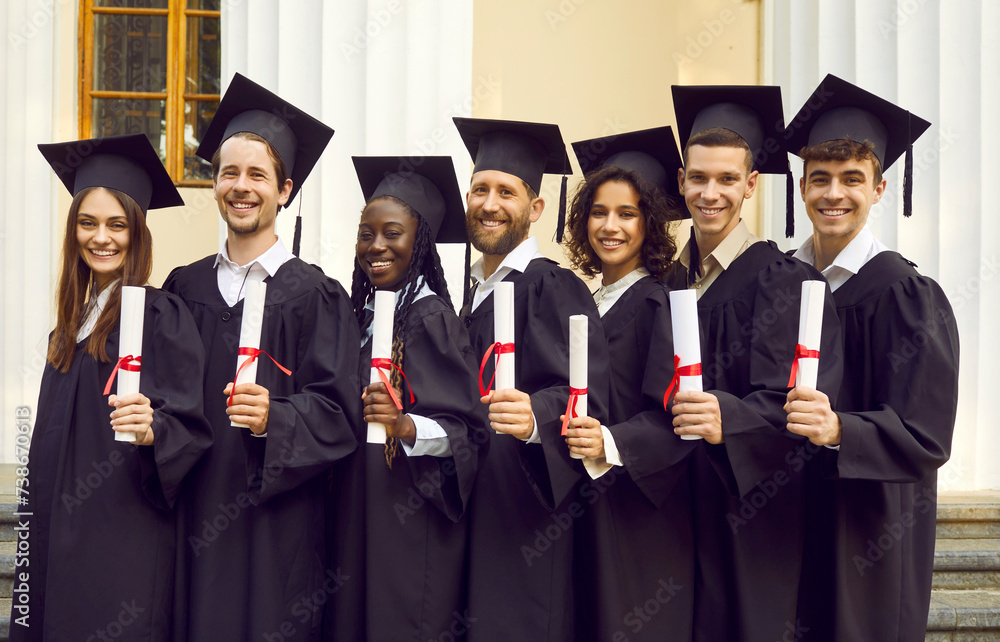 Group portrait of happy diverse college or university graduates. Seven ...