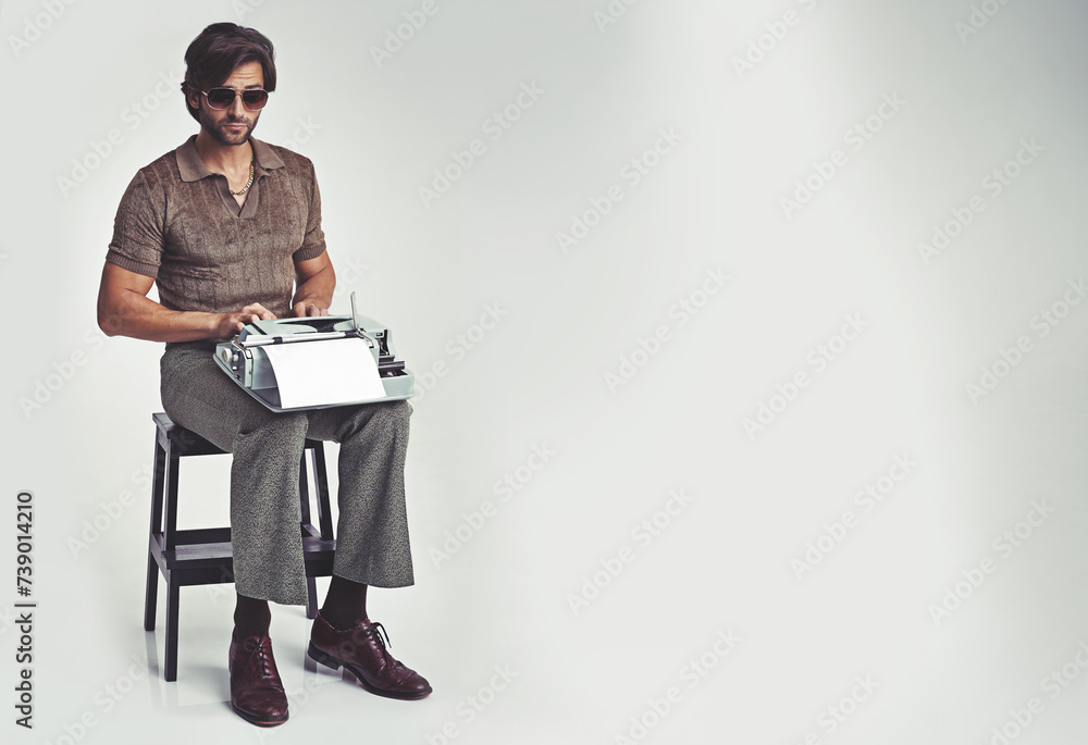Man, fashion and vintage with typewriter in studio on grey background ...