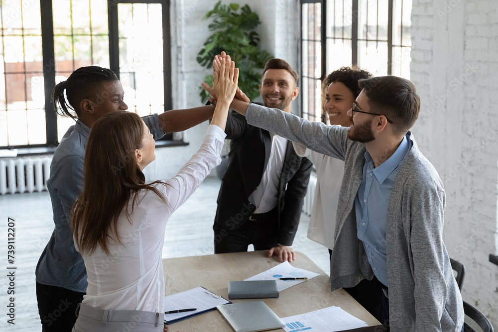 Well done. Smiling dedicated business partners in office happy that ...