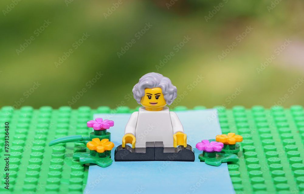 Baby boomer practicing yoga outdoors in nature. Senior woman healthy ...