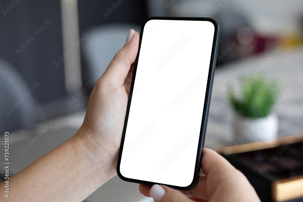 Female hand hold phone with isolated screen background cafe office ...