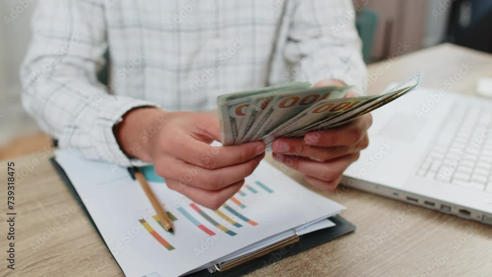 Close-up hands of businessman counting cash money dollar checking ...