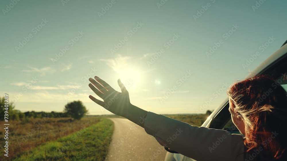 girl rides car with her hand out window, driver hand, girl waving her ...