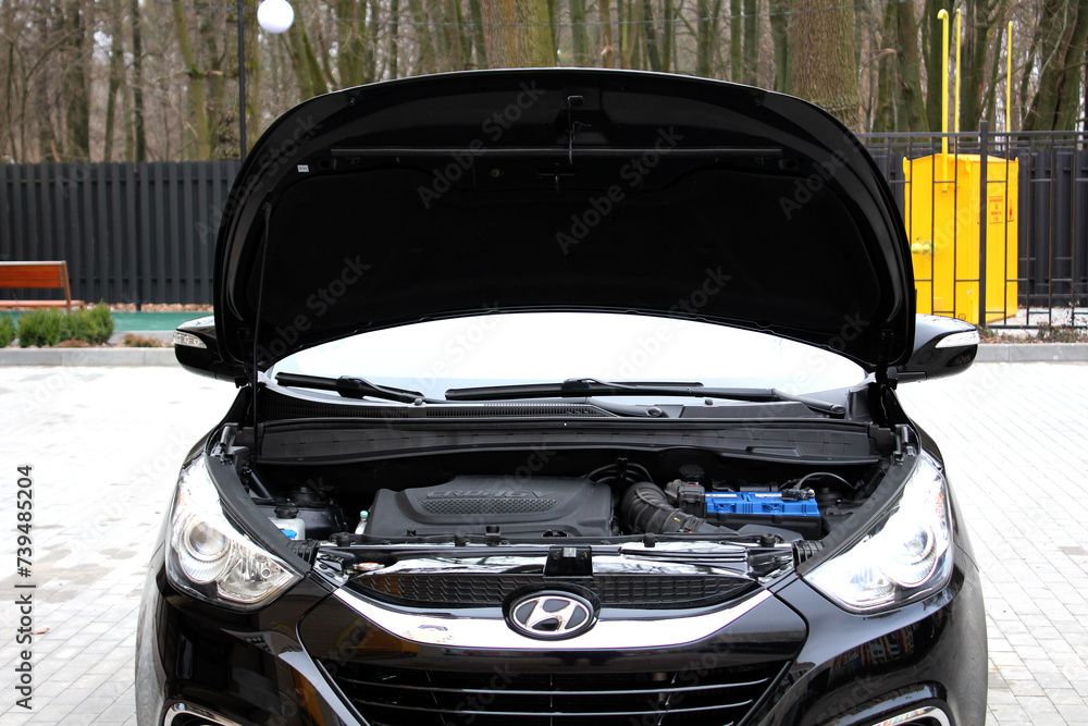 Vinnytsia, Ukraine; February 16, 2024. Black Hyundai ix35 open hood ...