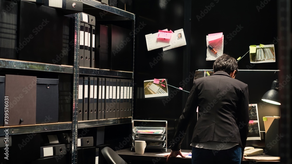 Private investigator working on police crime case, evaluating ...