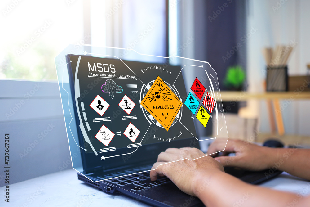 Material safety data sheet MSDS with staff on laptop computer to down ...