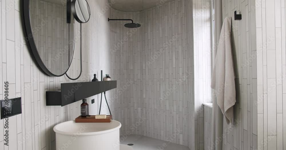 Modern interior of bathroom with shower system, wash basin, tiled wall ...