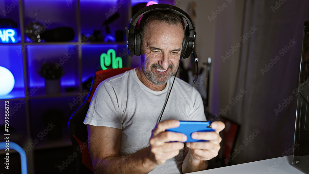 Confident, smiling middle age man with grey hair taking over the ...