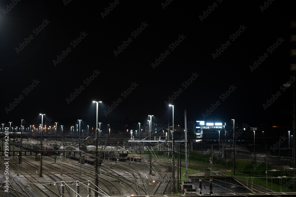Freight station at night in Zurich, Spreitenbach. Freight trains are ...