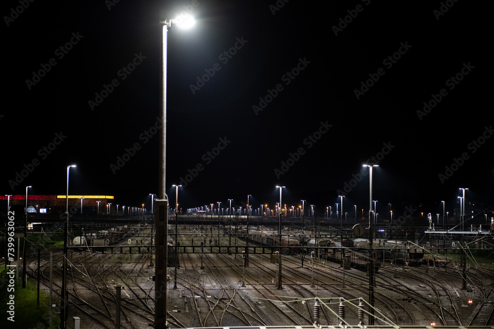 Freight station at night in Zurich, Spreitenbach. Freight trains are ...