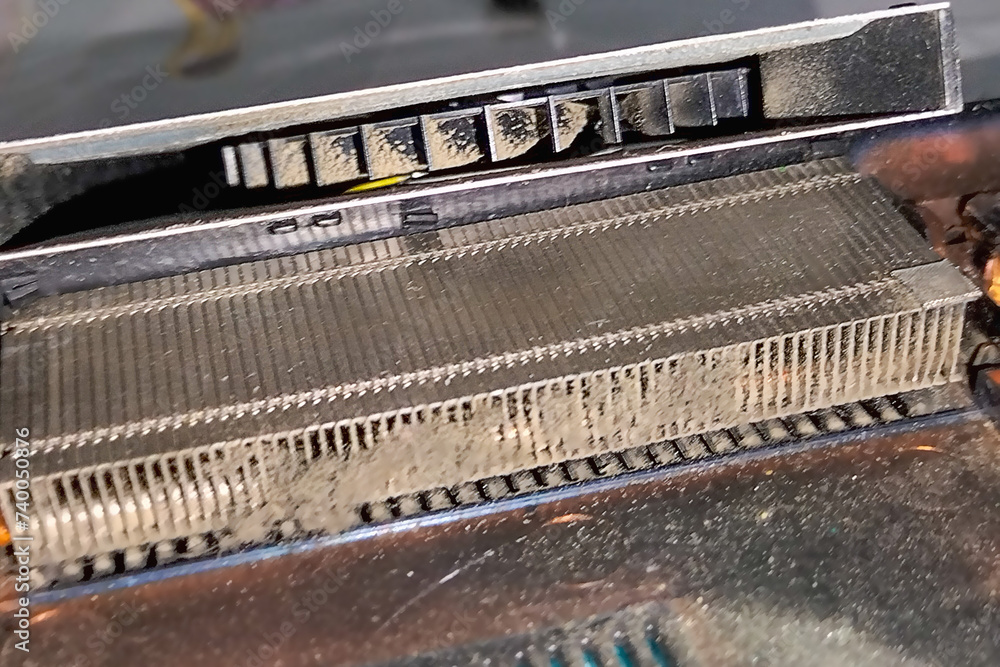 Laptop CPU cooling fan and radiator with clogged guide vanes. In work ...