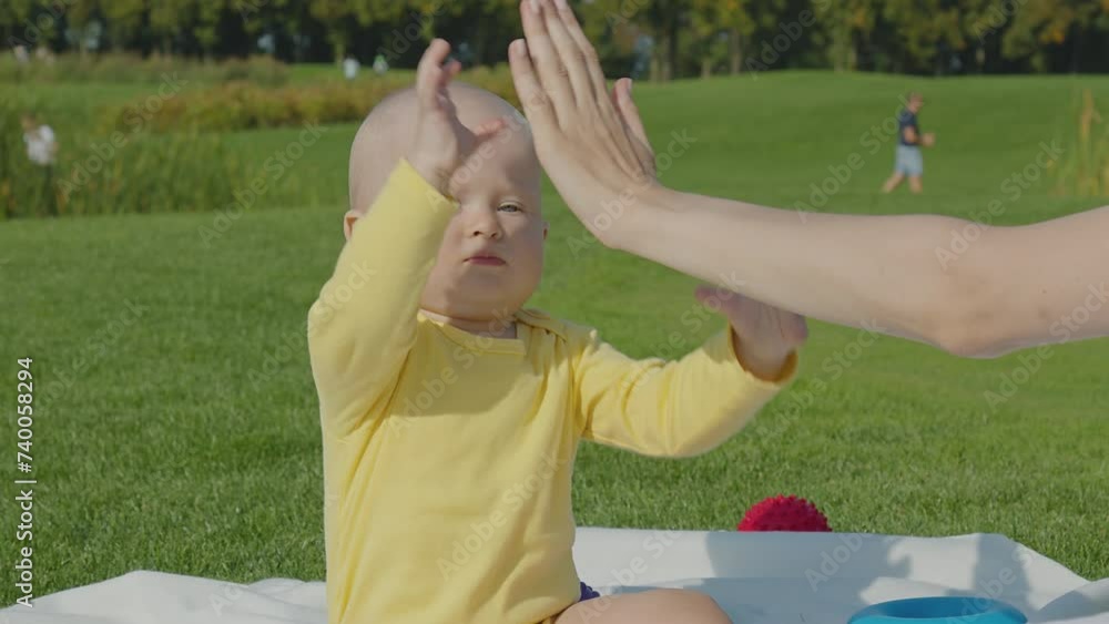 Cute Infant try high five, outdoor playtime, joyful learn activity ...