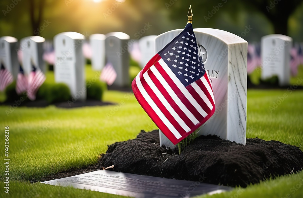 The American flag placed on the grave of a fallen soldier, a poignant tribute to their sacrifice ...