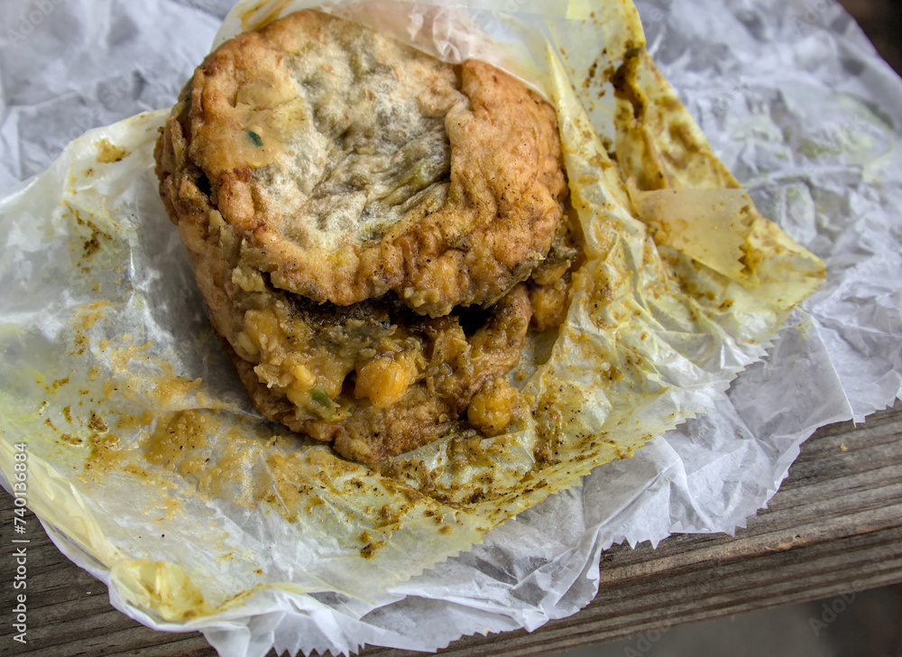 doubles unwrapped on parchment paper (Trinidadian specialty food) chana ...