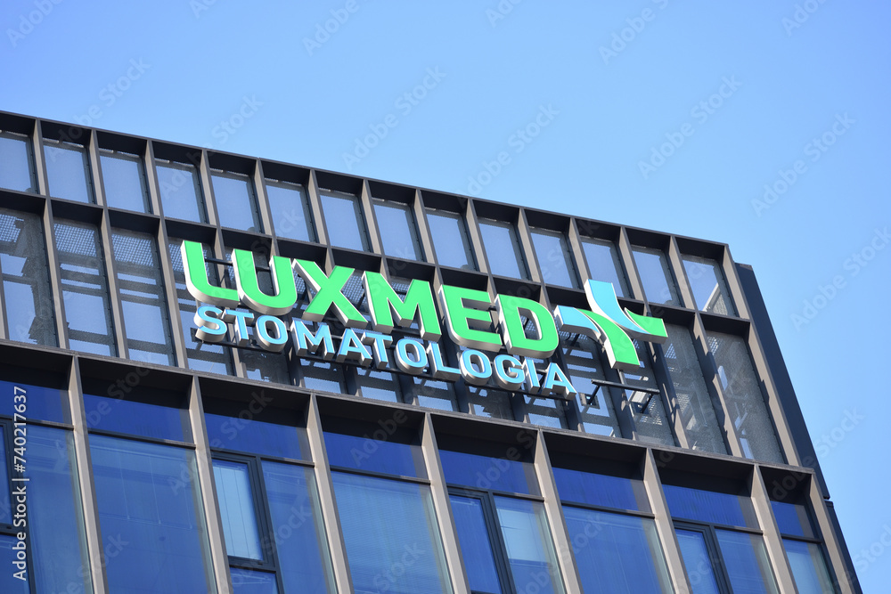 Luxmed Stomatologia (LUX MED) medical center, facade of the building with signage, logo, emblem ...