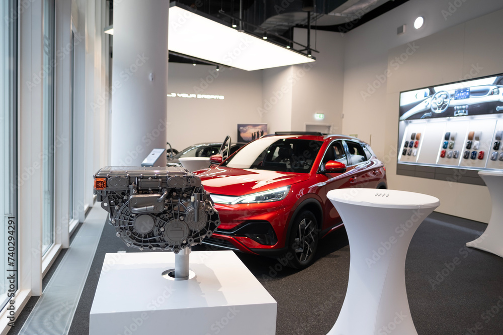 innovative electric motor BYD Electric against background of red BYD ...
