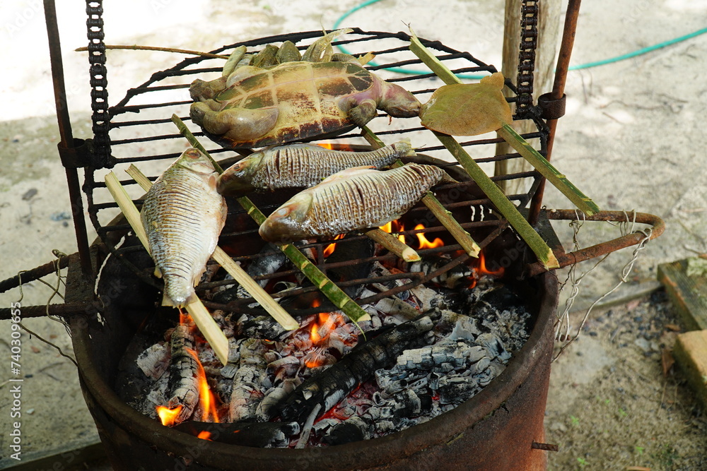 Old grill with glowing charcoal. Barbecue of animals that died during ...