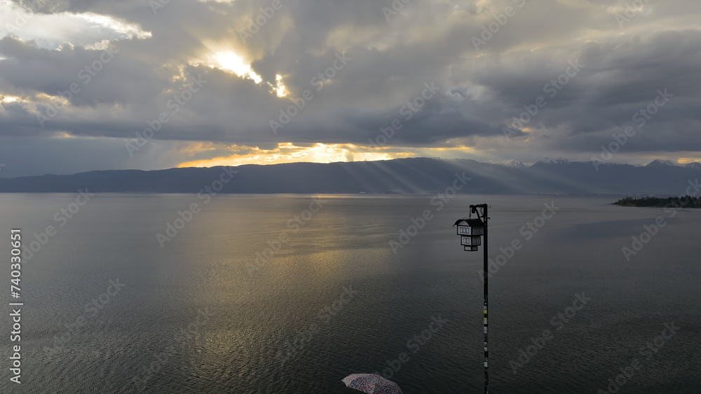 Crepuscular light rays -God Rays- casting over the west shore Lake ...