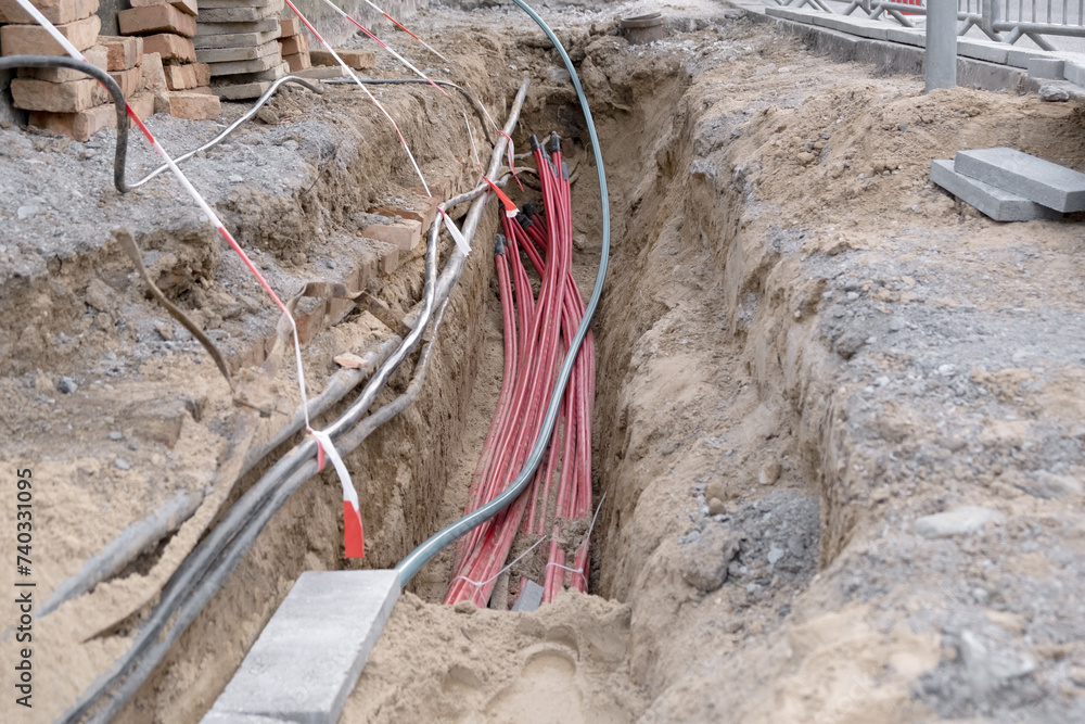 underground electric cable infrastructure installation. Construction ...